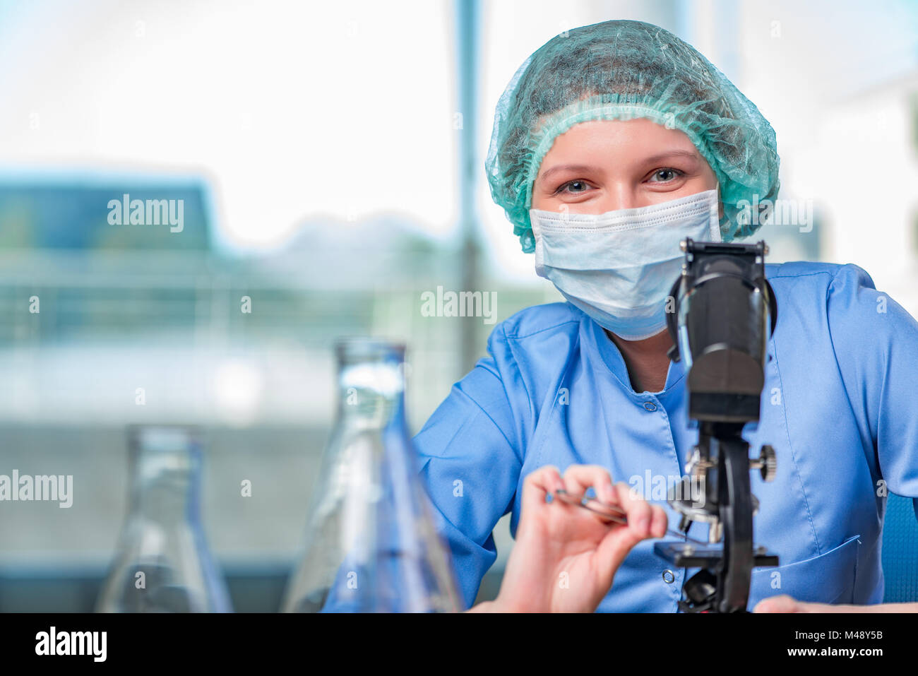 Experienced lab assistant working on chemical solutions Stock Photo - Alamy