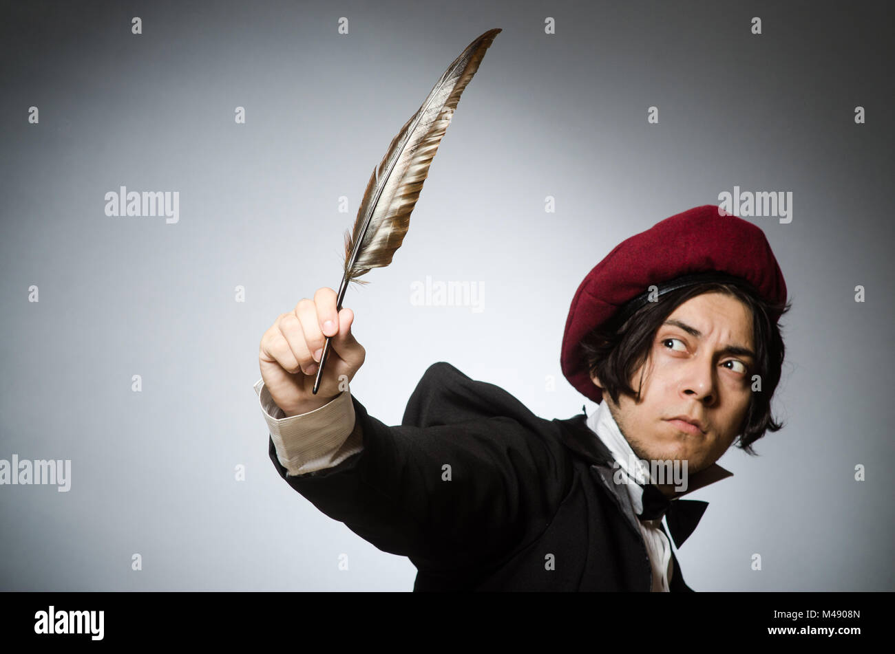 Funny writer with quill in vintage concept Stock Photo - Alamy