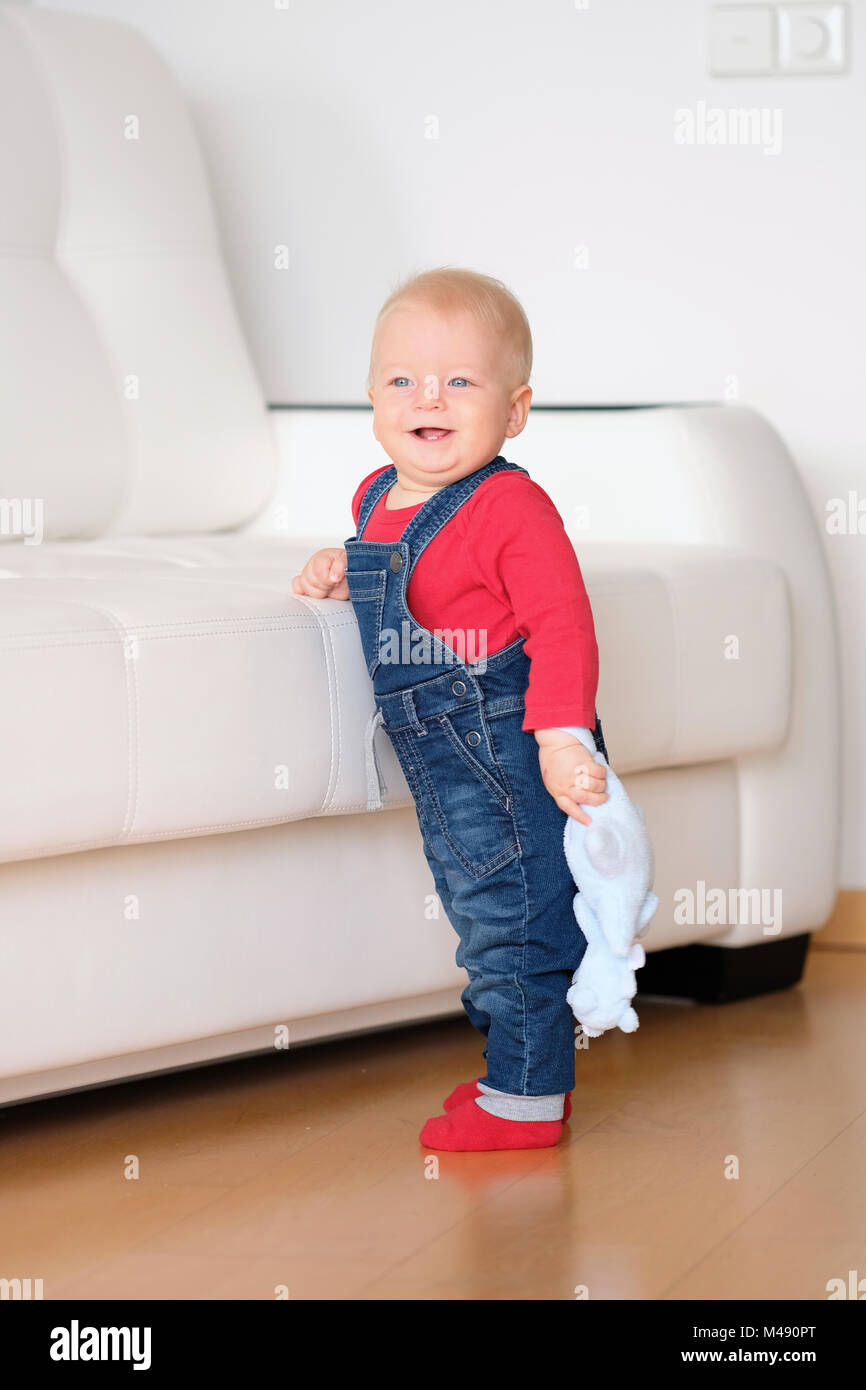 Baby boy standing Stock Photo - Alamy