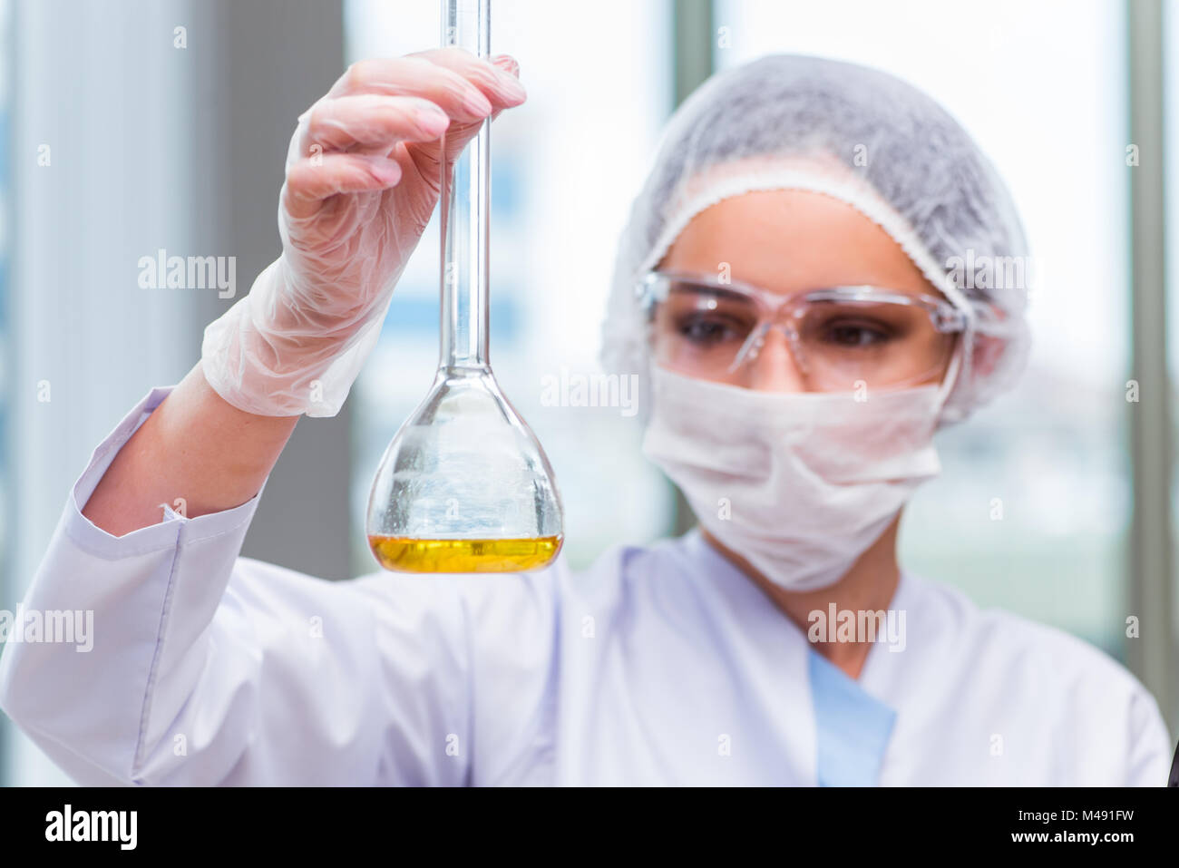 Young student working with chemical solutions in lab Stock Photo - Alamy