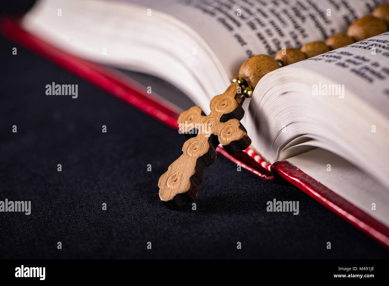 Bible and cross in religious concept Stock Photo - Alamy