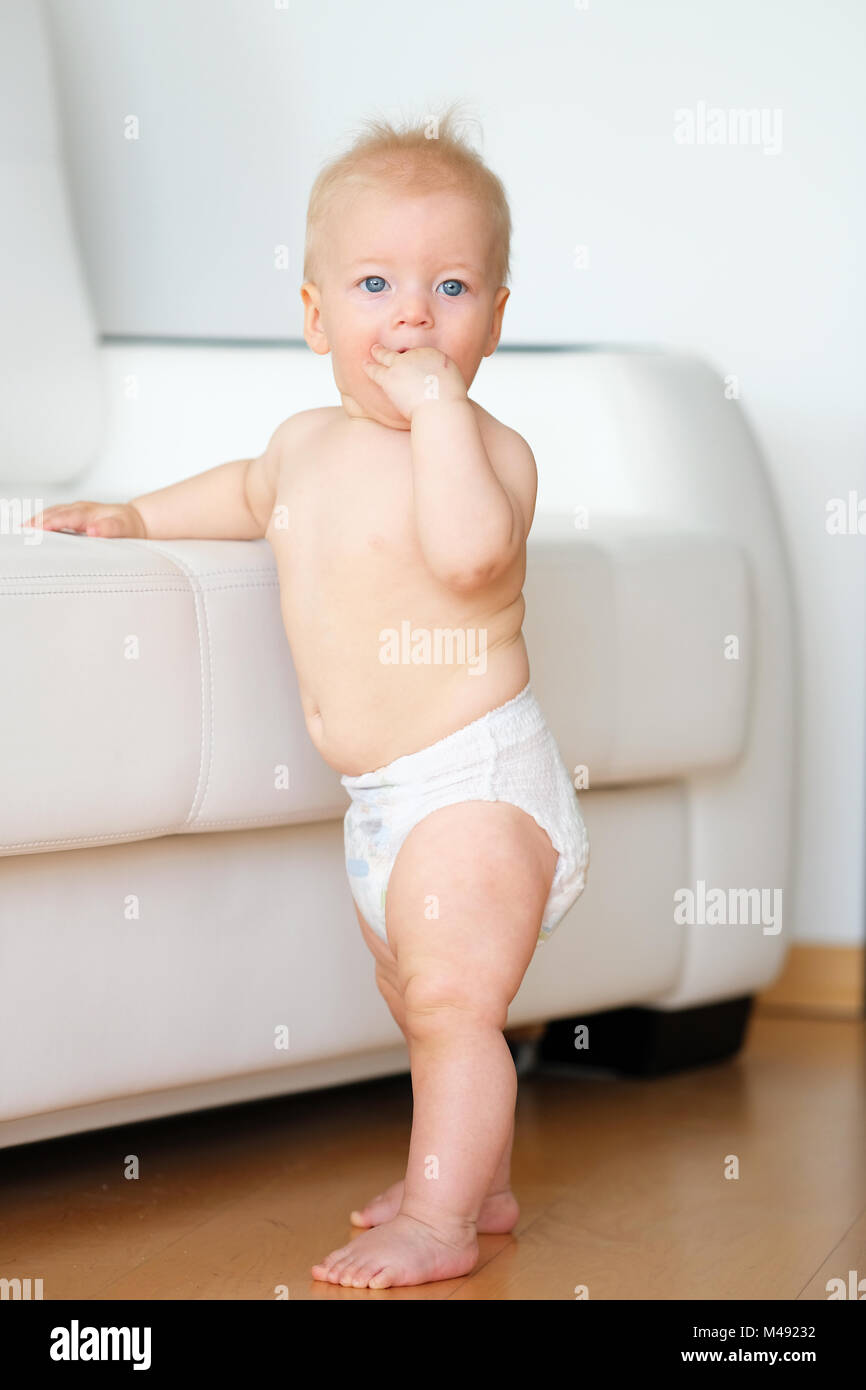Baby boy standing Stock Photo - Alamy