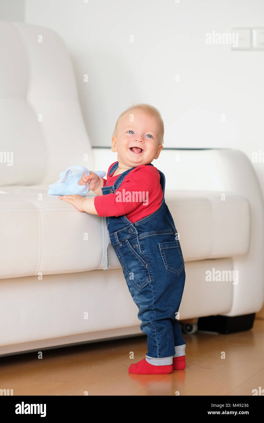 Baby boy standing Stock Photo - Alamy