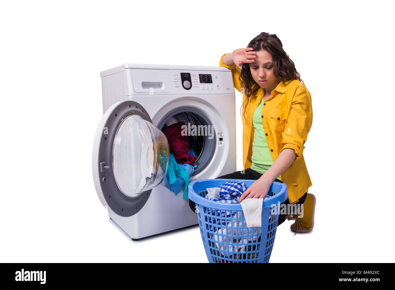 Woman tired after doing laundry isolated on white Stock Photo - Alamy