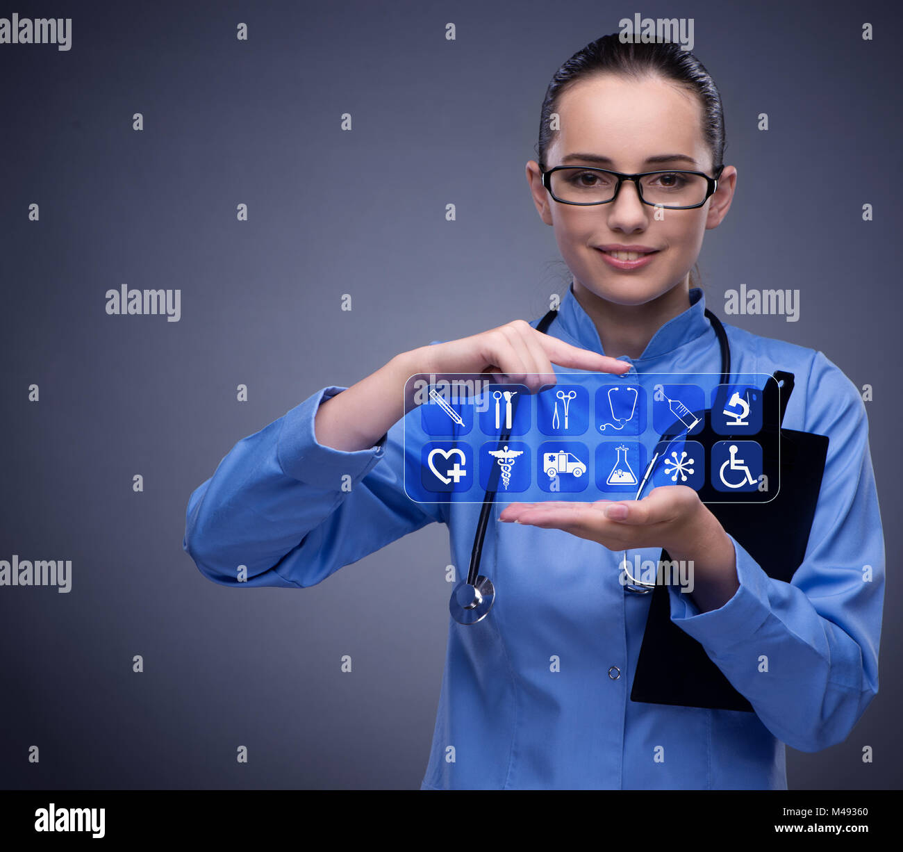 Woman doctor pressing buttons with various medical icons Stock Photo ...