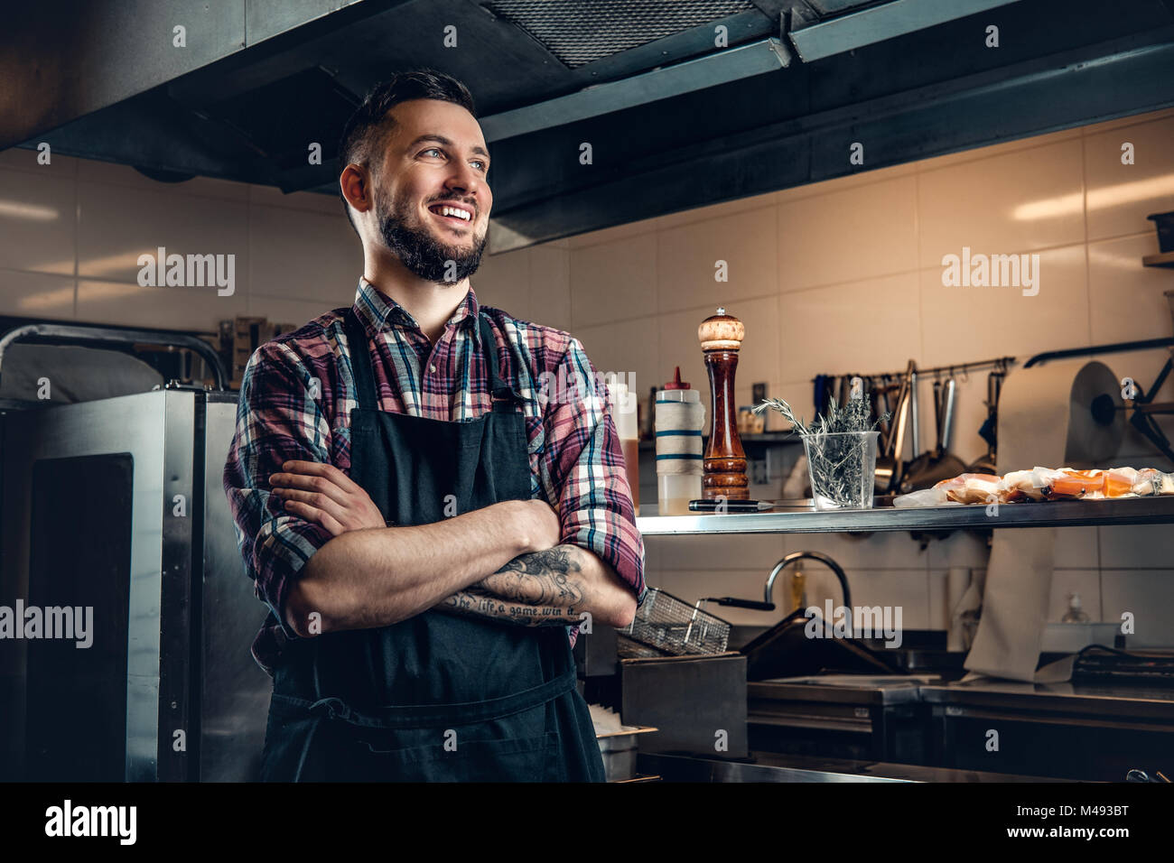 Portrait of stylish cook on a kitchen Stock Photo - Alamy