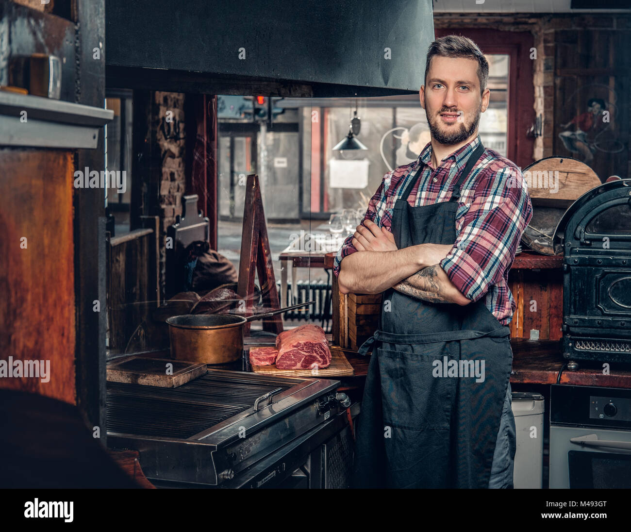 Portrait of stylish cook on a kitchen Stock Photo - Alamy