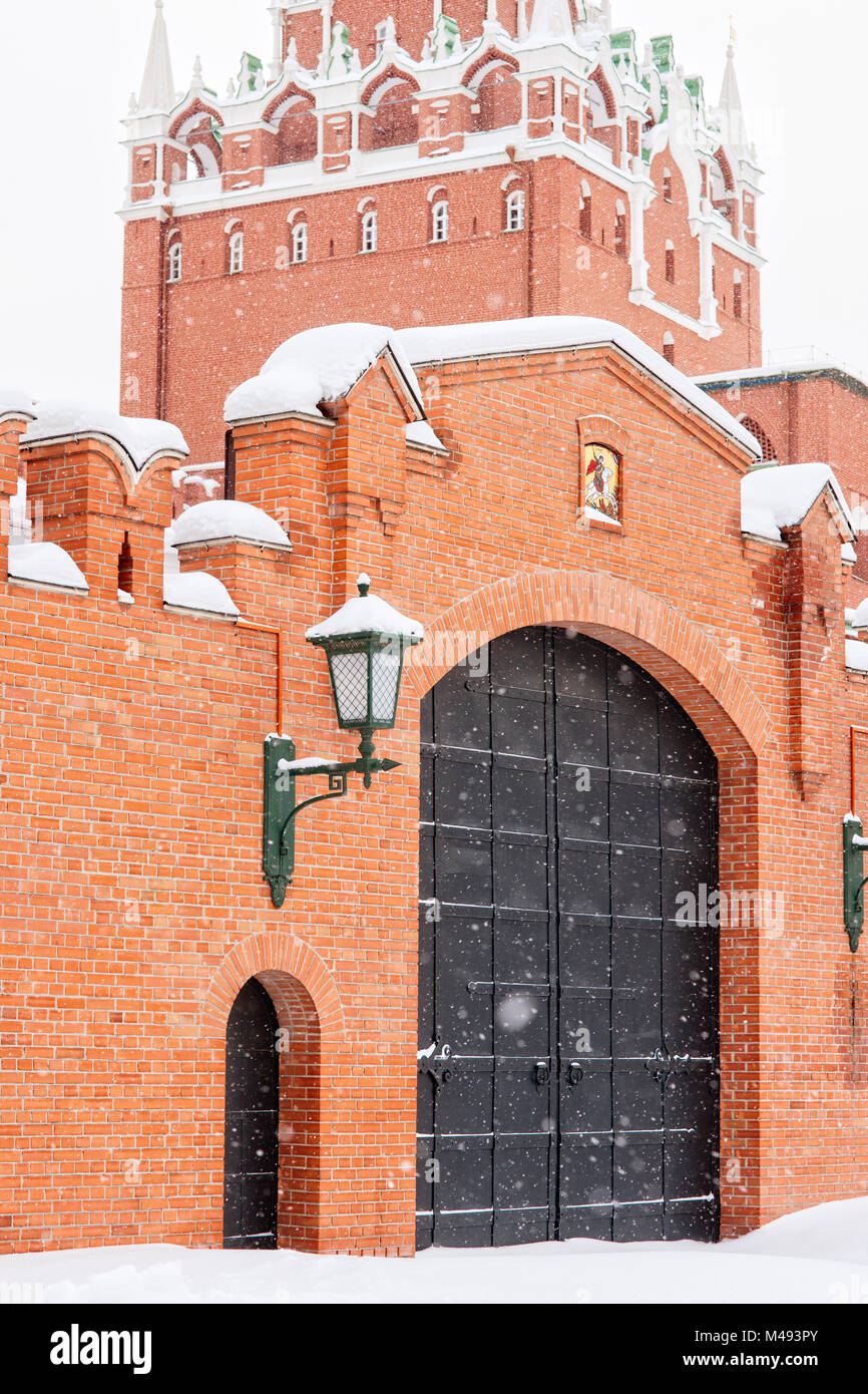 Moscow Kremlin structure with a vintage lamp, icon and old metal gates ...