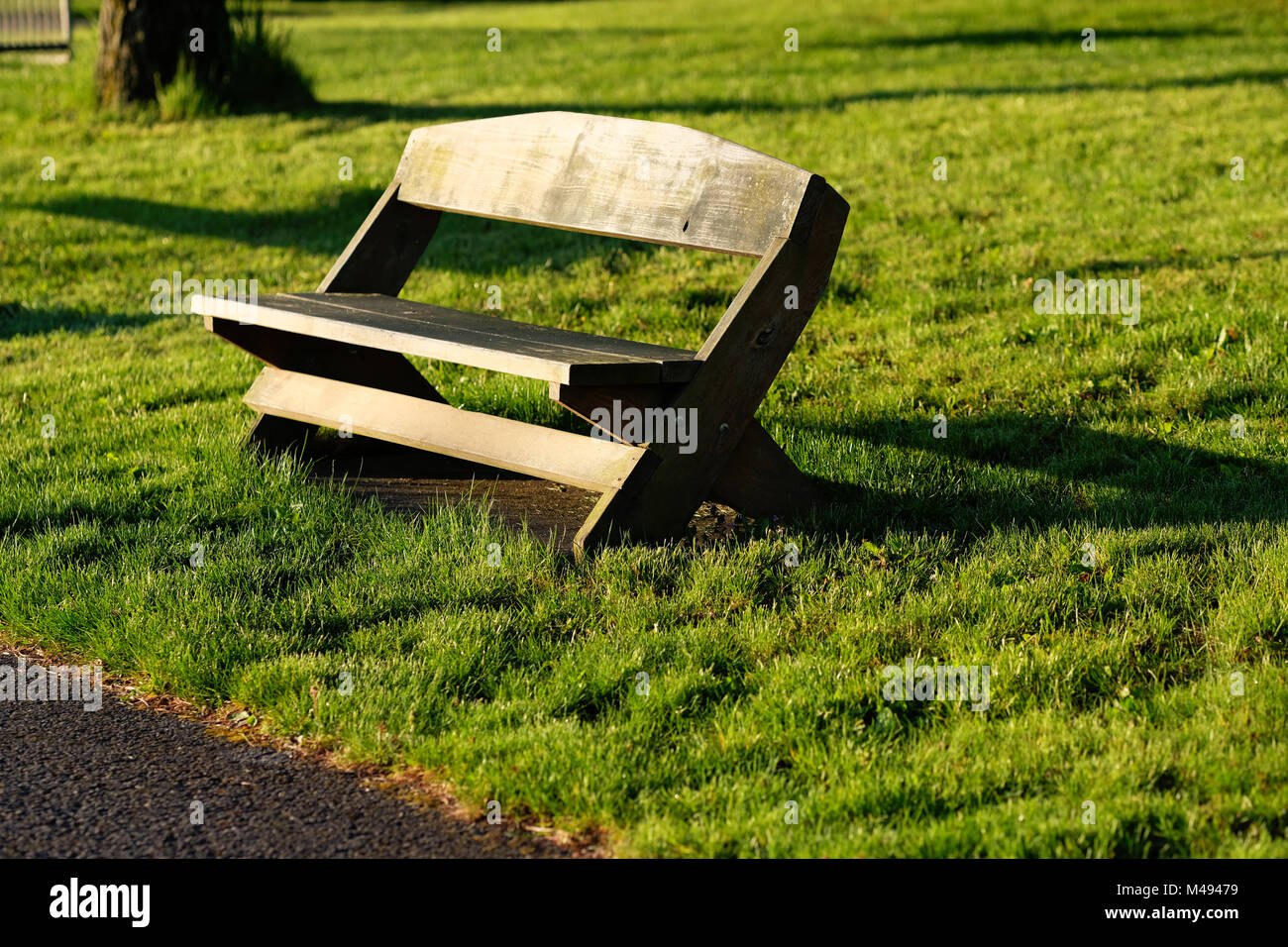 Wooden bench on the meadow Stock Photo - Alamy