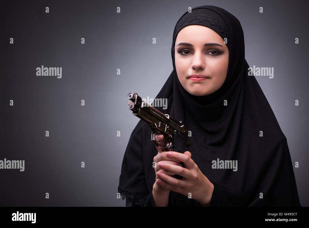 Muslim woman with gun hi-res stock photography and images - Alamy