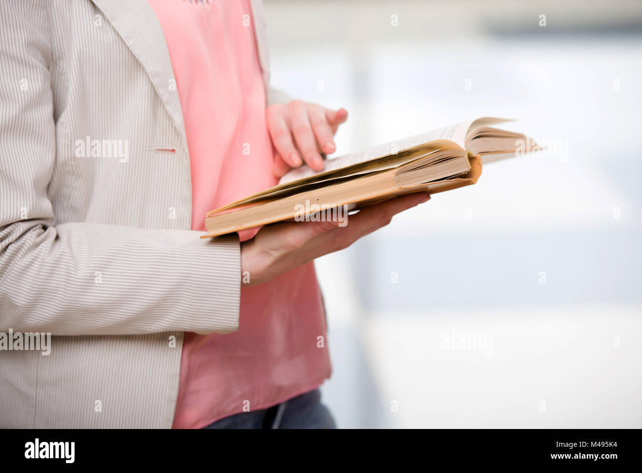 Young student reading book in preparation for exams Stock Photo - Alamy
