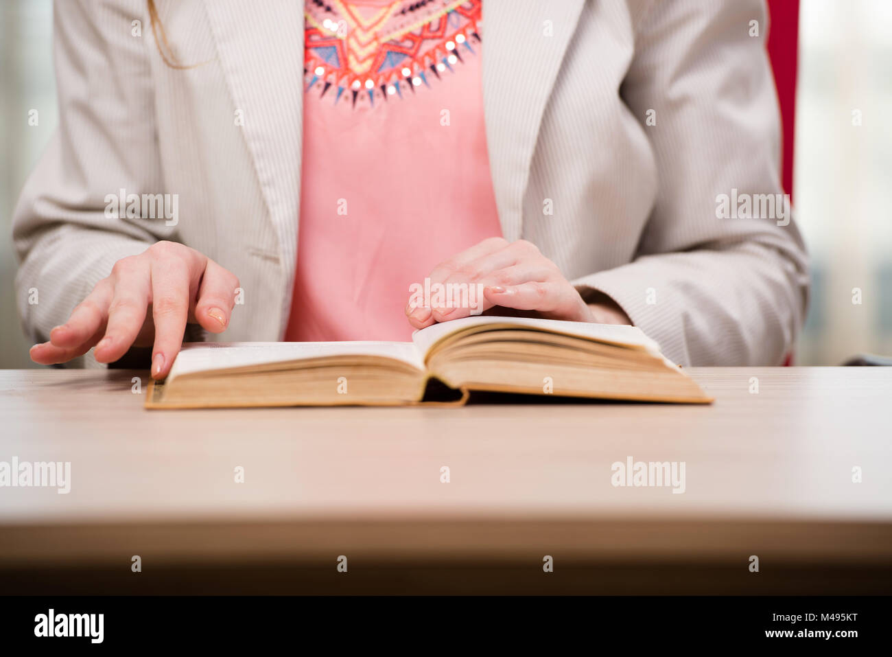 Young student reading book in preparation for exams Stock Photo - Alamy