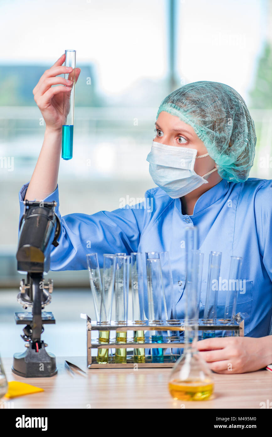 Experienced lab assistant working on chemical solutions Stock Photo - Alamy