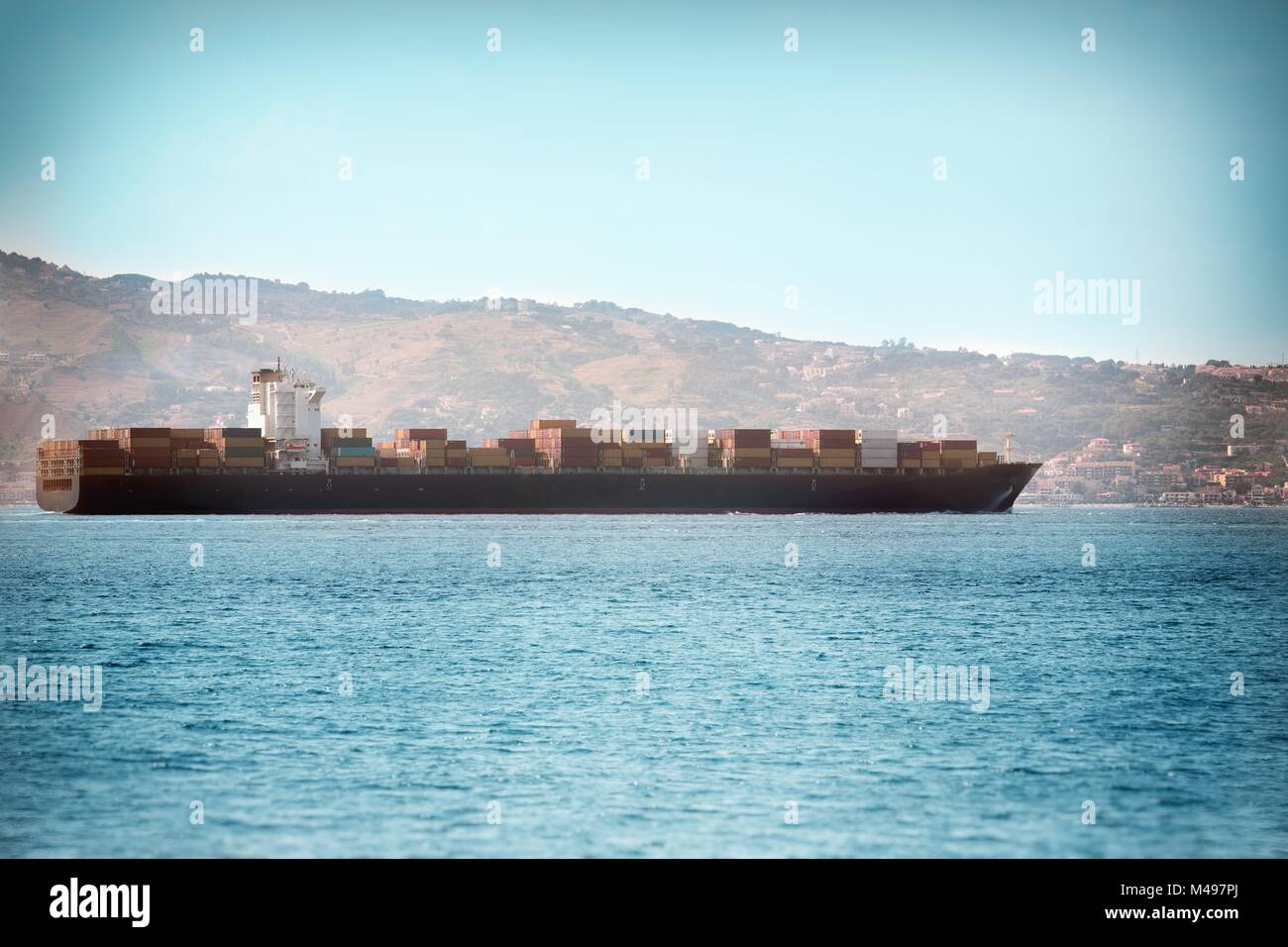 Large container ship, which sails on the open sea Stock Photo - Alamy