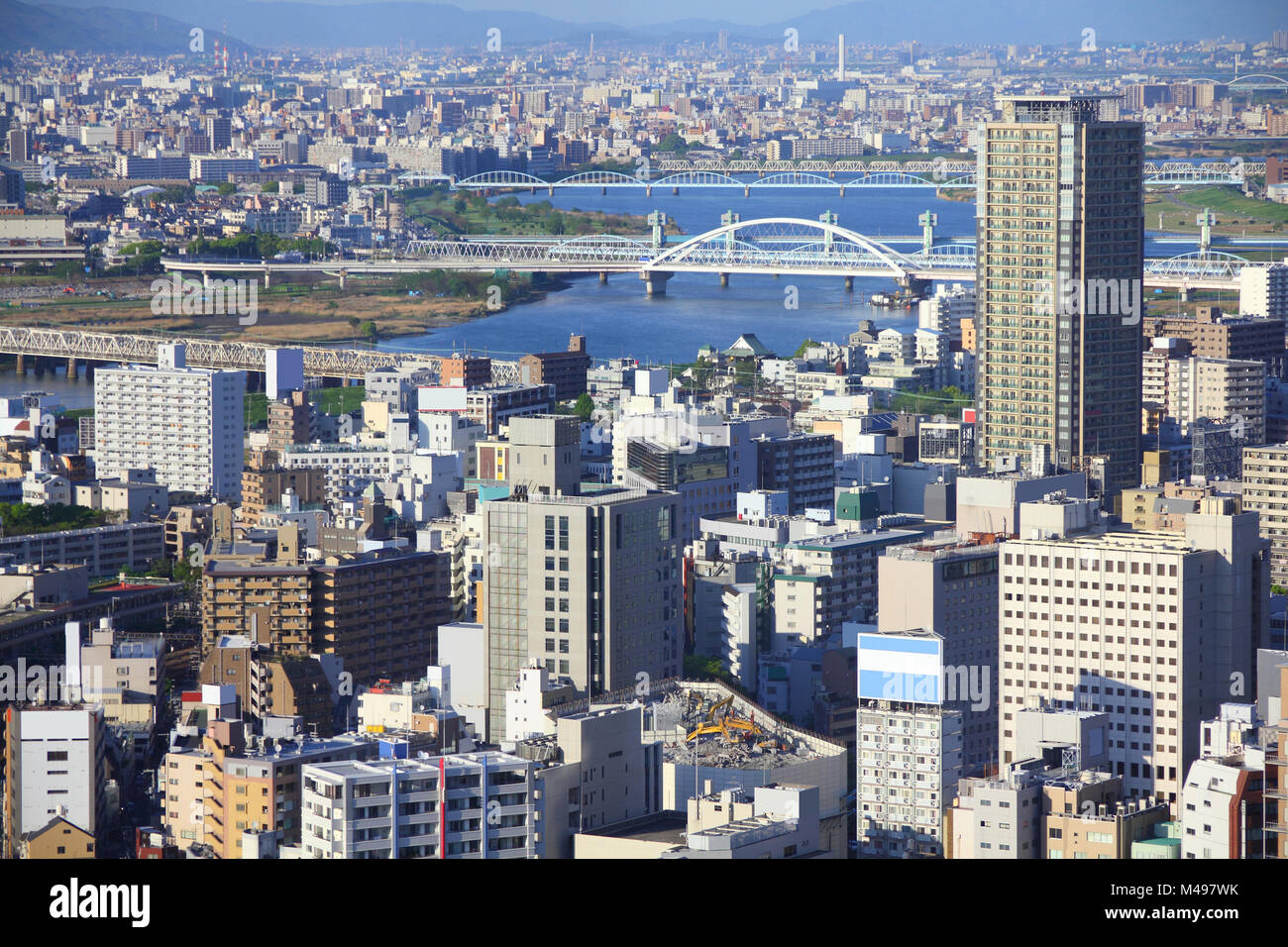 Osaka, Japan - skyline of famous city in the region Kansai. Modern ...
