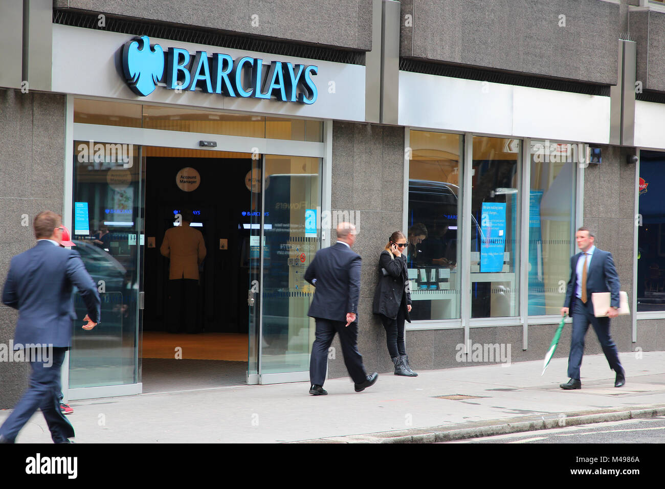 LONDON - MAY 15: People walk by Barclays bank branch on May 15, 2012 in ...