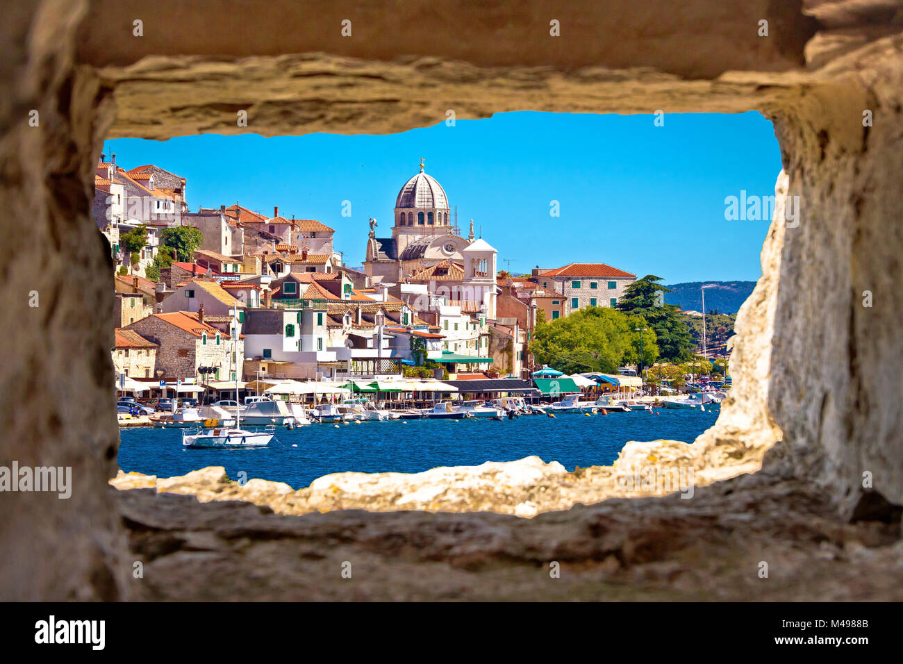 Sibenik waterfront through stone window view Stock Photo - Alamy
