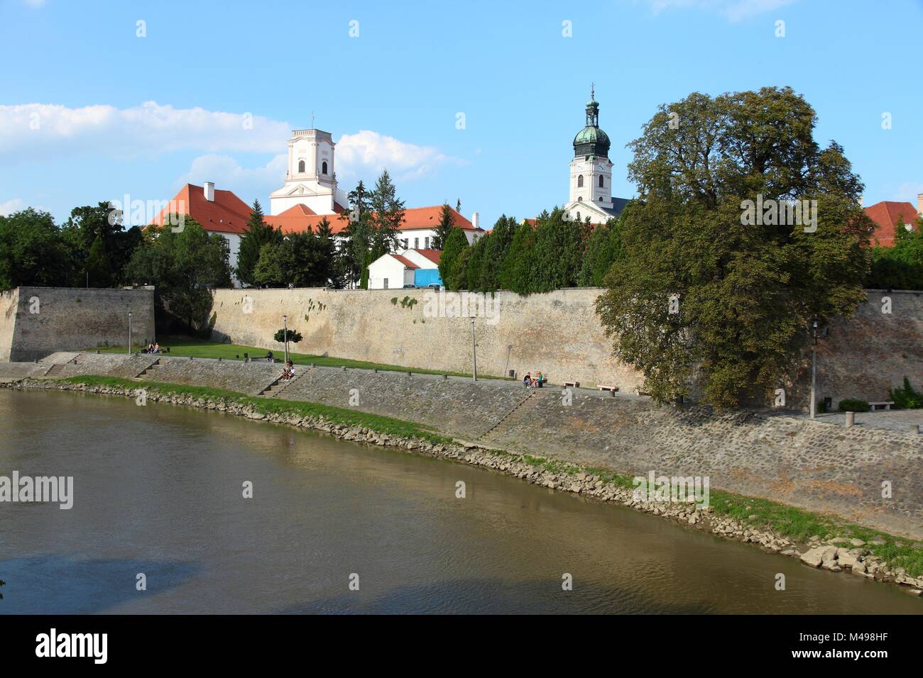 Gyor, Hungary - Old Town skyline and Raba river embankment with park ...
