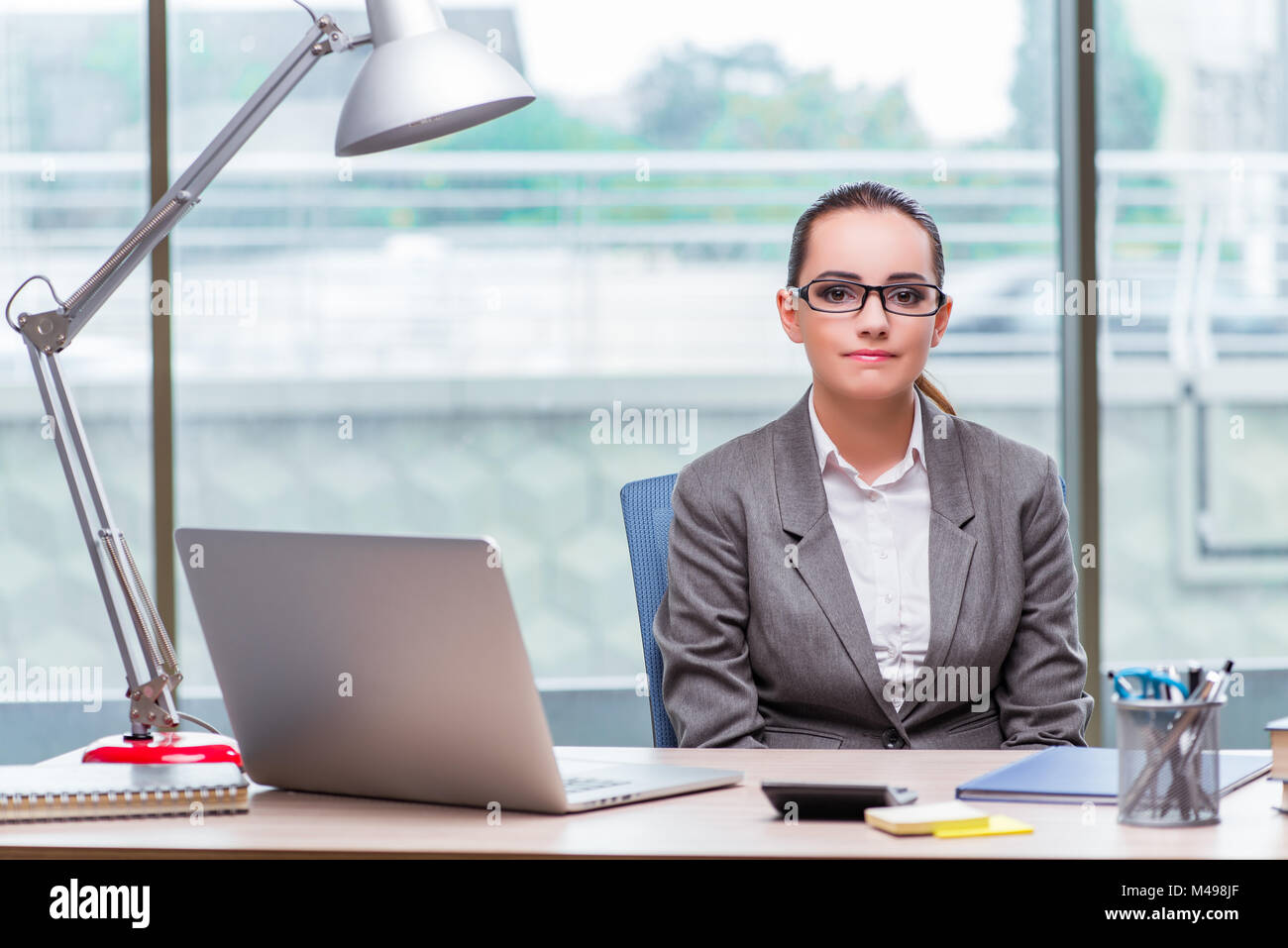 Young assistant working in the office Stock Photo - Alamy