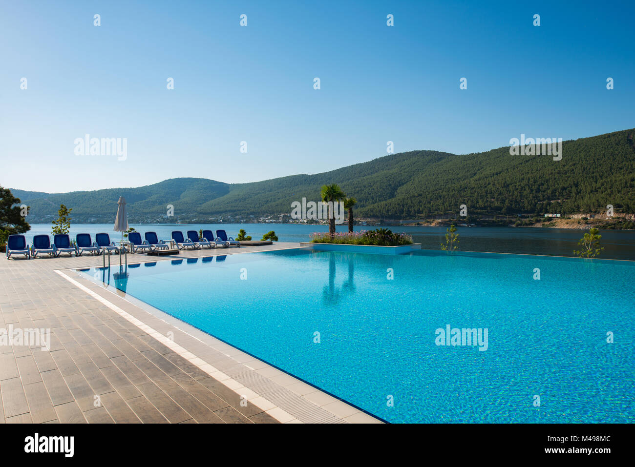 Nice swimming pool outdoors on bright summer day Stock Photo - Alamy