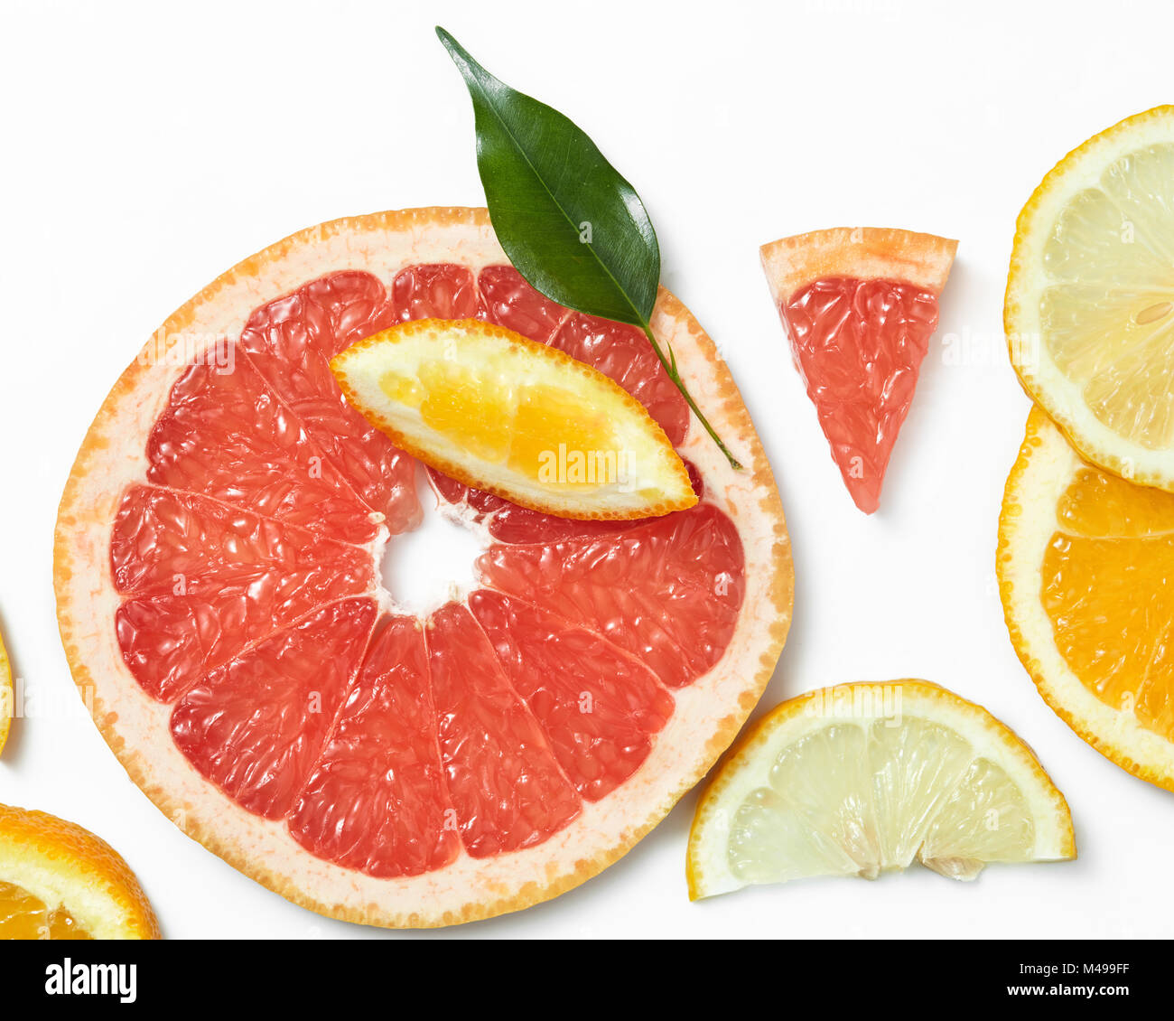 Fresh citrus fruits slices background viewed from above Stock Photo - Alamy