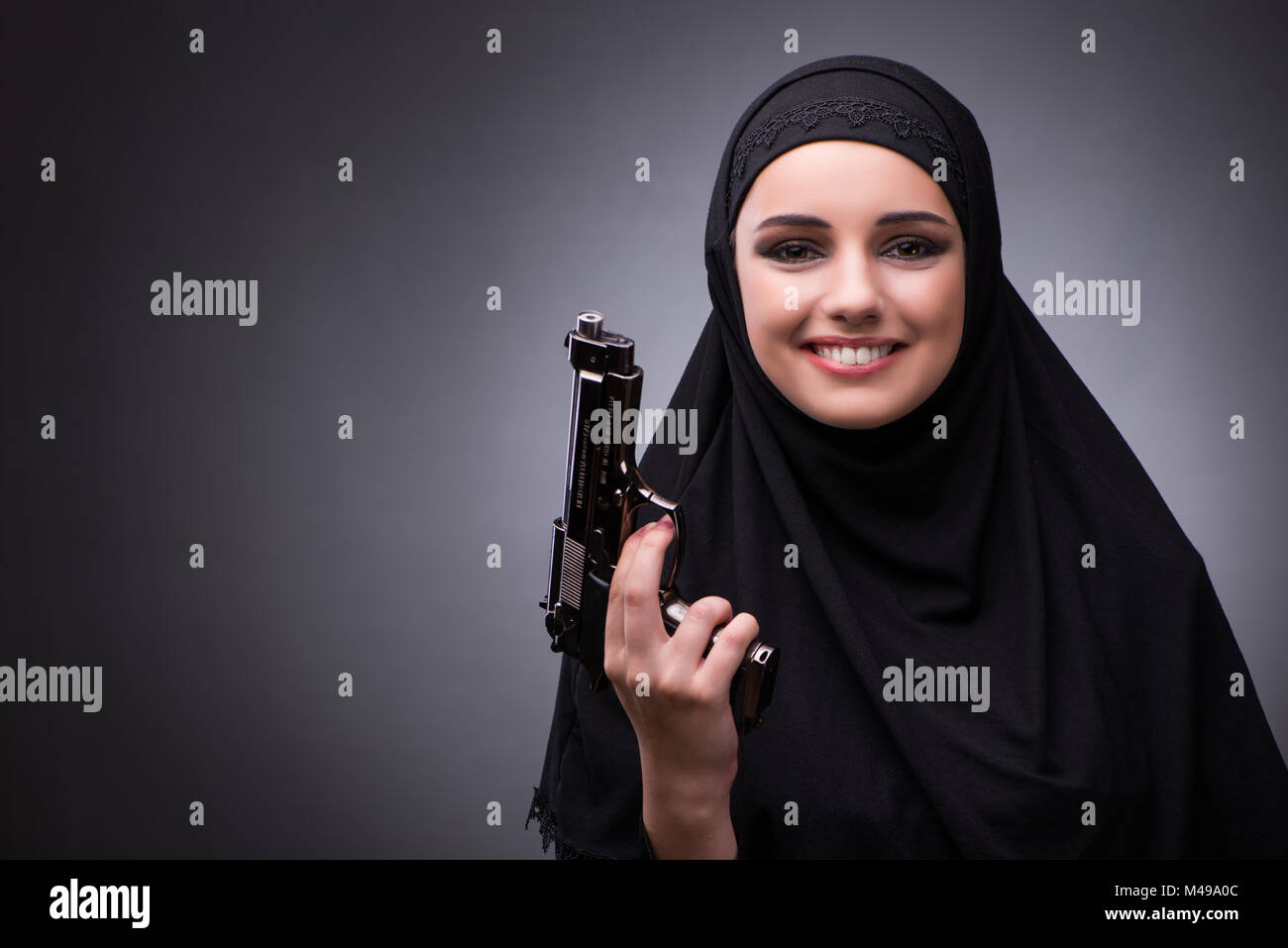 Muslim woman with gun hi-res stock photography and images - Alamy