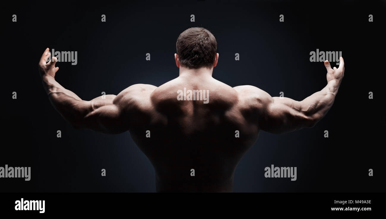 Close up of sports man's muscular back isolated Stock Photo - Alamy