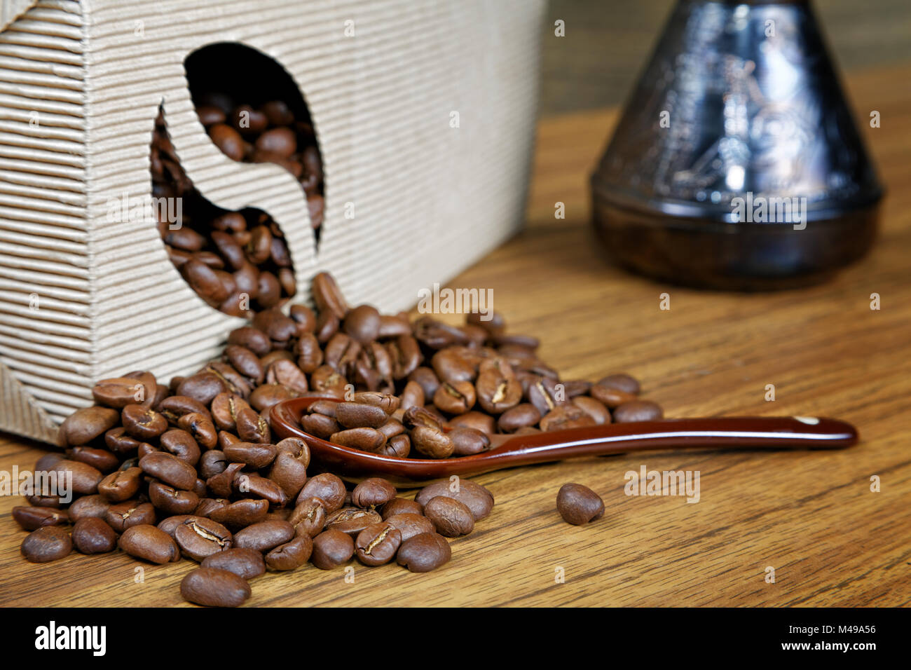 coffee beans spill out of the box on the table Stock Photo - Alamy