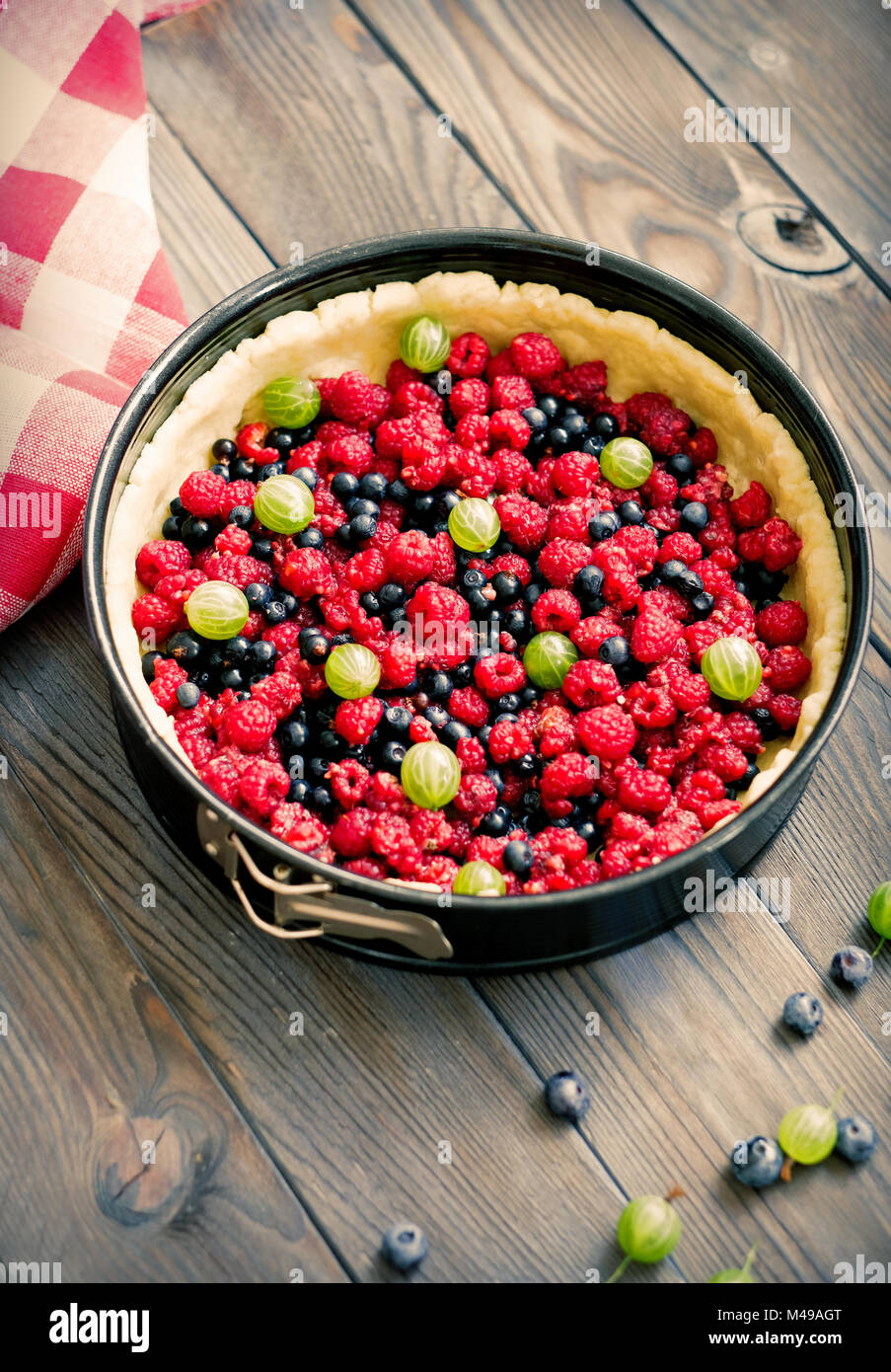 Wild berry pie with raspberries and blueberries Stock Photo - Alamy