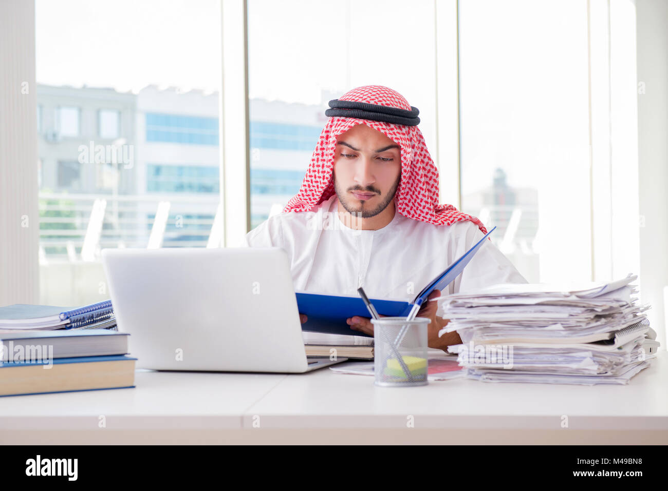 Arab businessman working in the office Stock Photo - Alamy