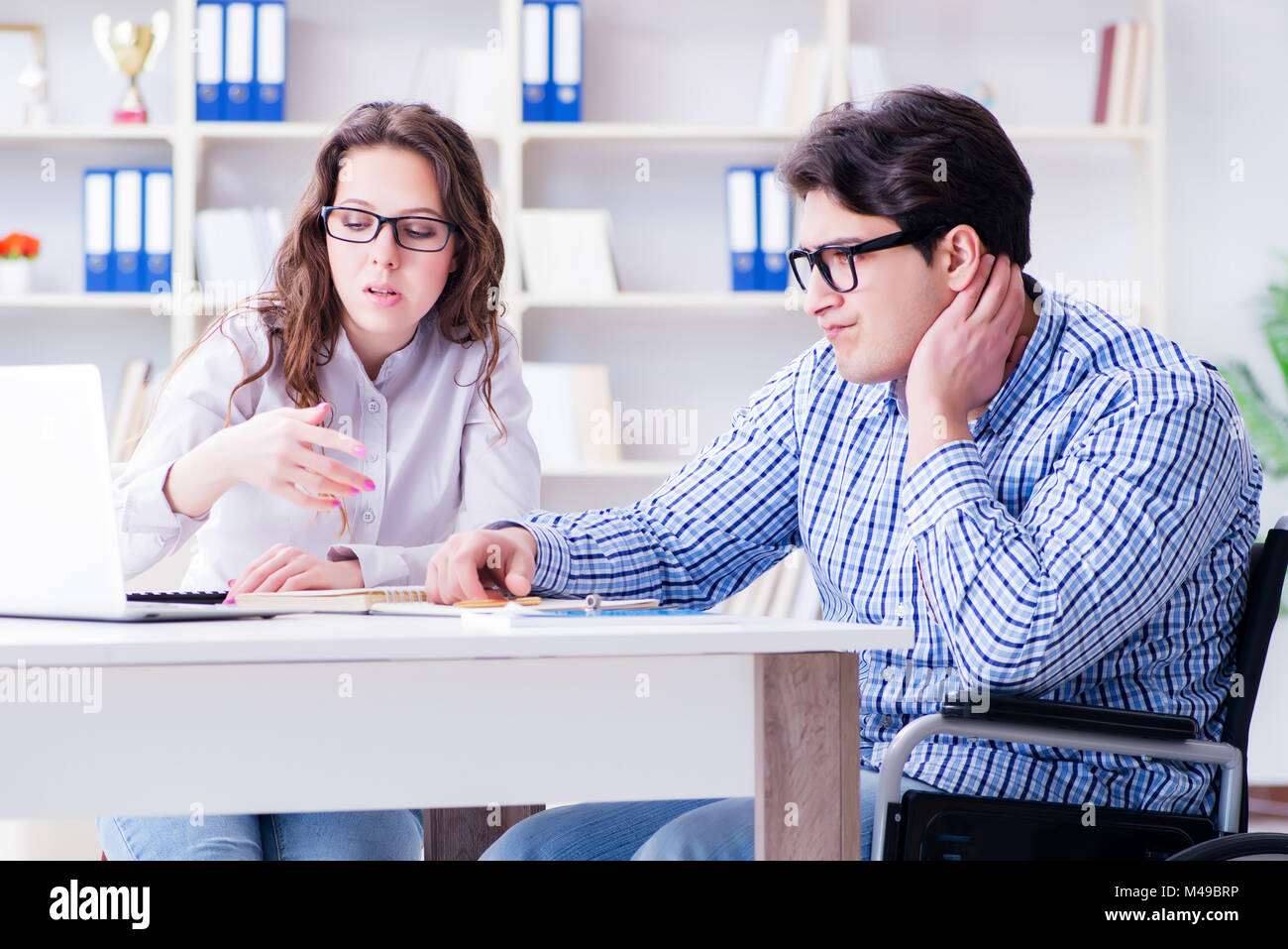 Disabled student studying and preparing for college exams Stock Photo ...