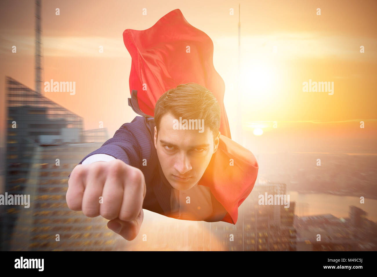 Flying super hero over the city Stock Photo - Alamy