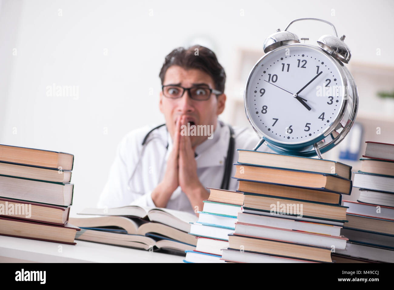 Medical student running out of time for exams Stock Photo - Alamy
