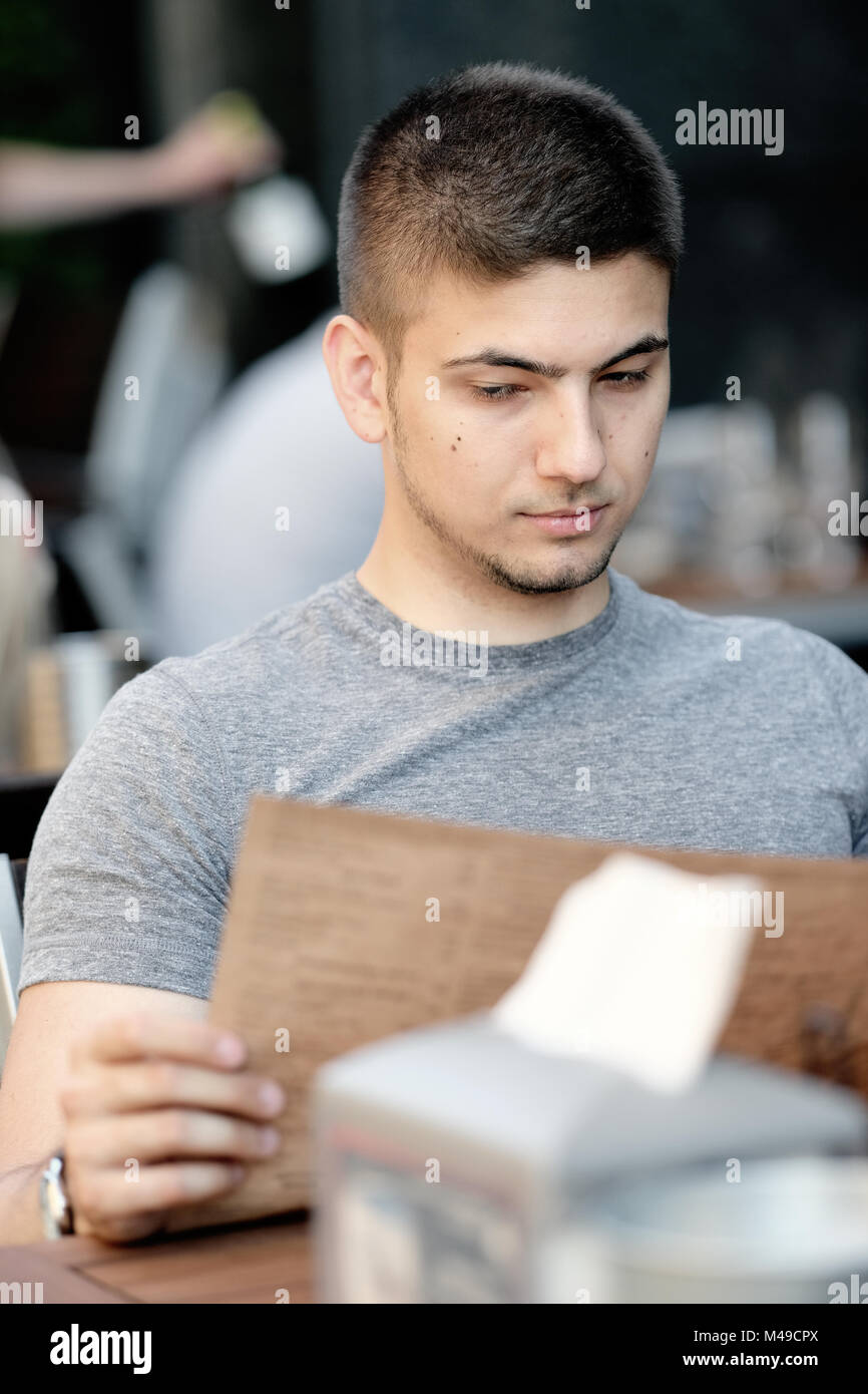 Guy looking at menu hi-res stock photography and images - Alamy