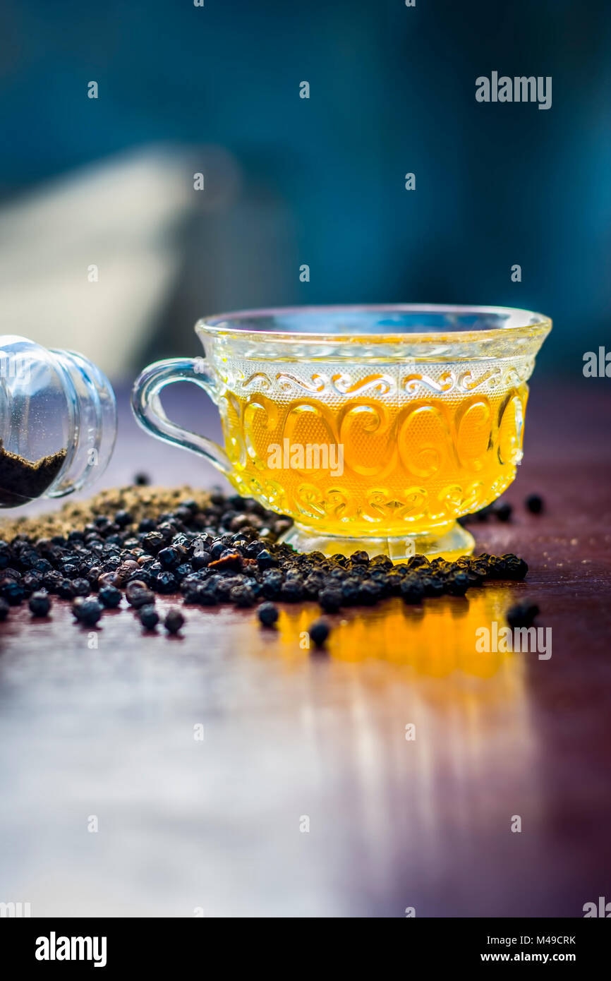 Close up of tea of Black pepper,Piper nigrum with raw black pepper and ...