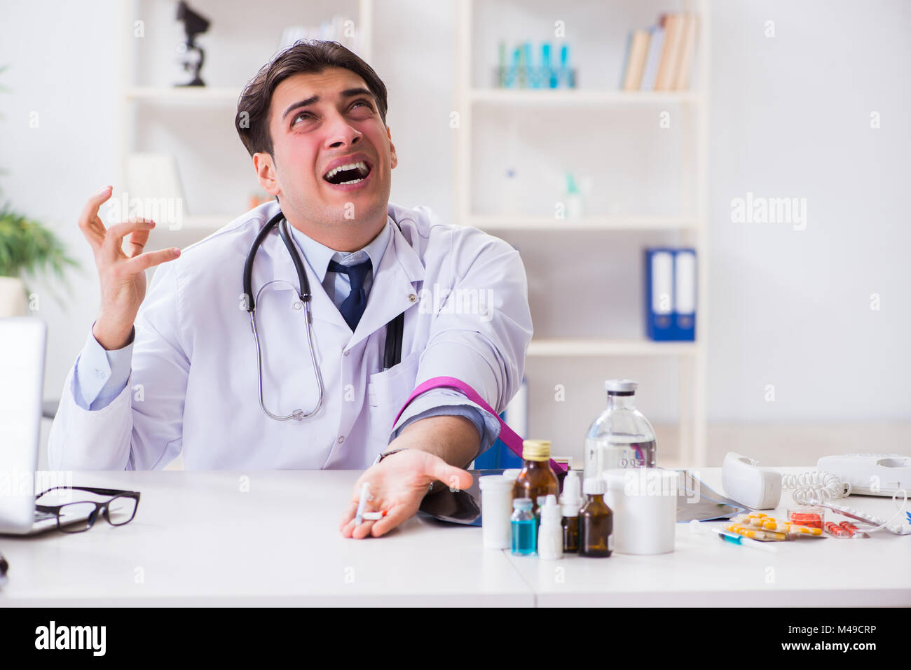 Doctor drug addict in the hospital Stock Photo - Alamy