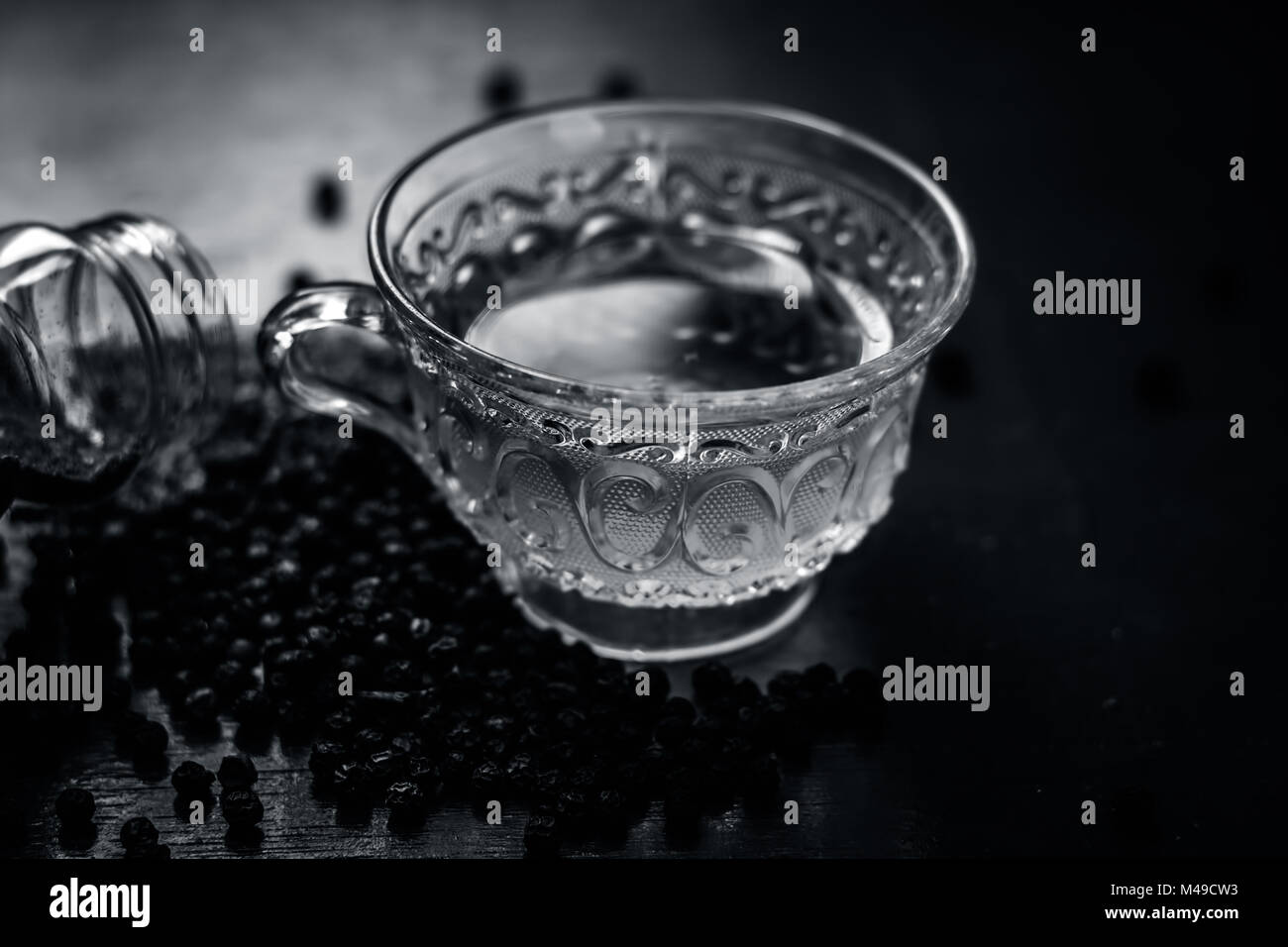 Close up of tea of Black pepper,Piper nigrum with raw black pepper and ...