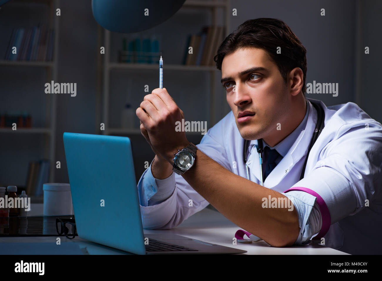 Doctor drug addict staying late on hospital Stock Photo - Alamy
