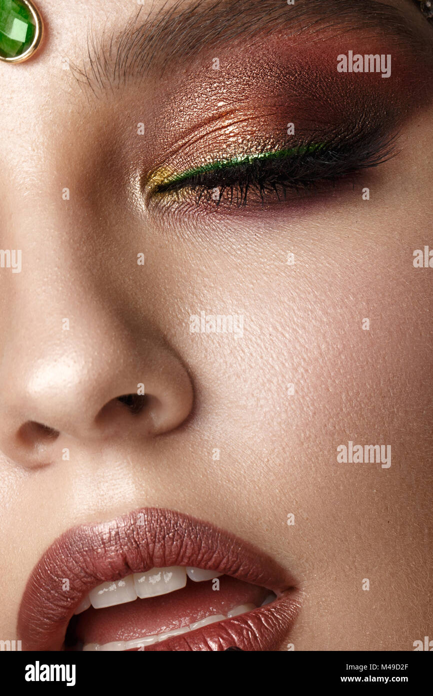 Beautiful girl with creative colorful makeup. Beauty face Stock Photo ...