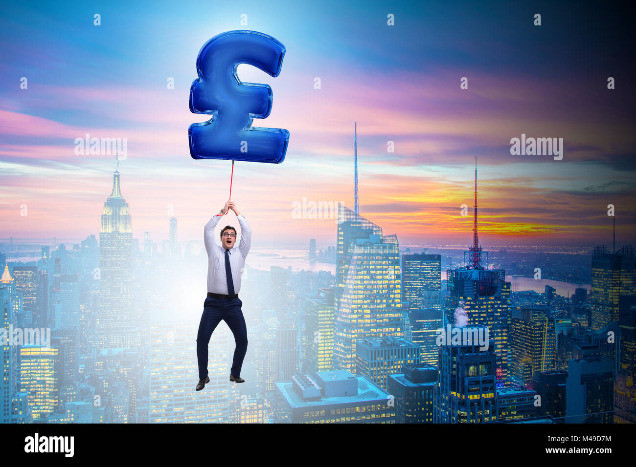 Businessman flying on british pound sign inflatable balloon Stock Photo ...
