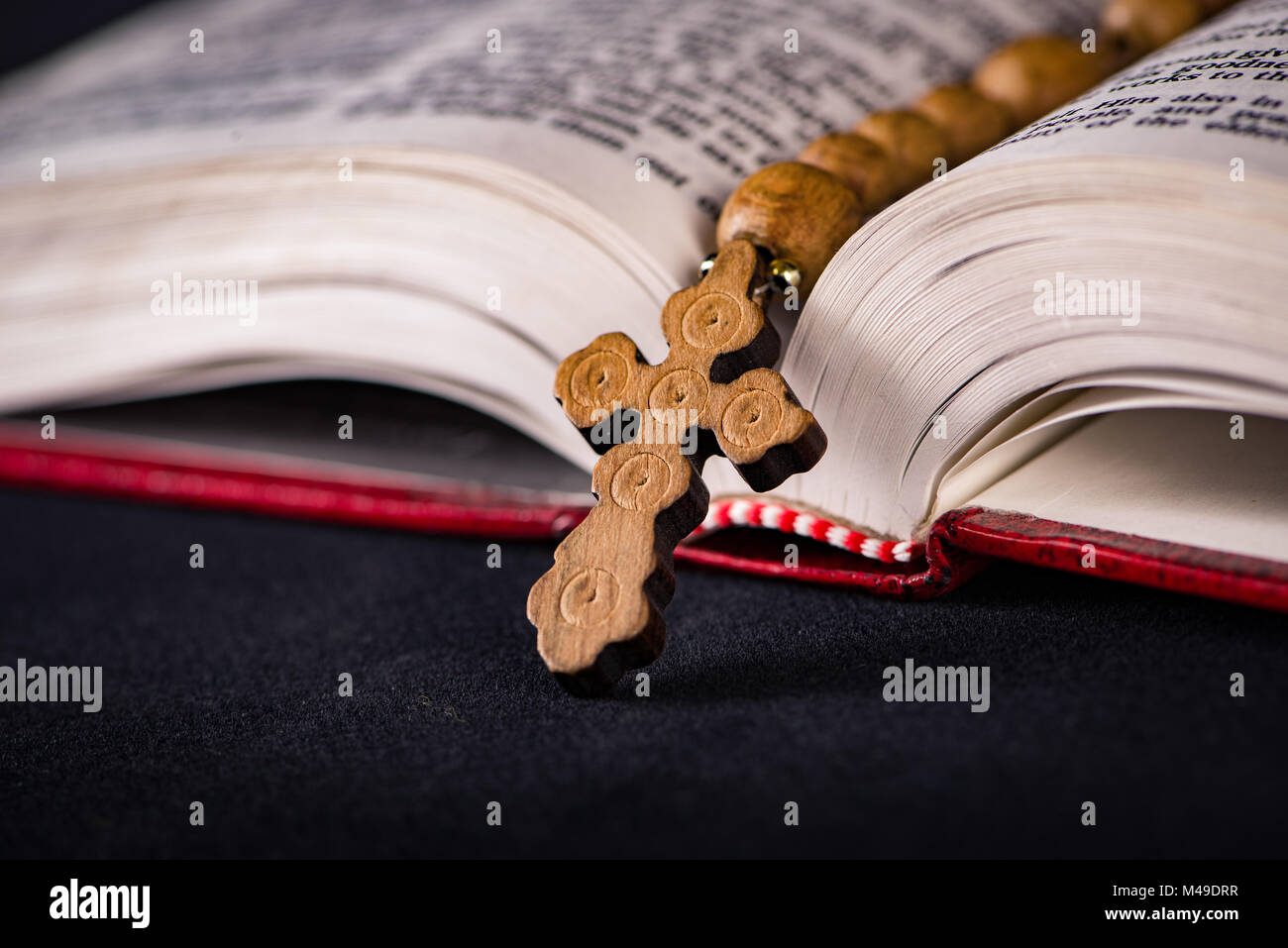 Bible and cross in religious concept Stock Photo - Alamy