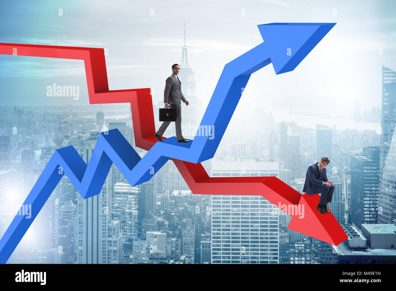 Businessman with charts of growth and decline Stock Photo - Alamy