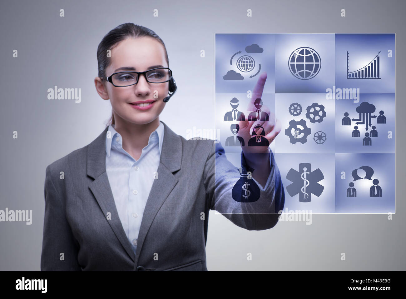 Woman pressing buttons in business concept Stock Photo - Alamy