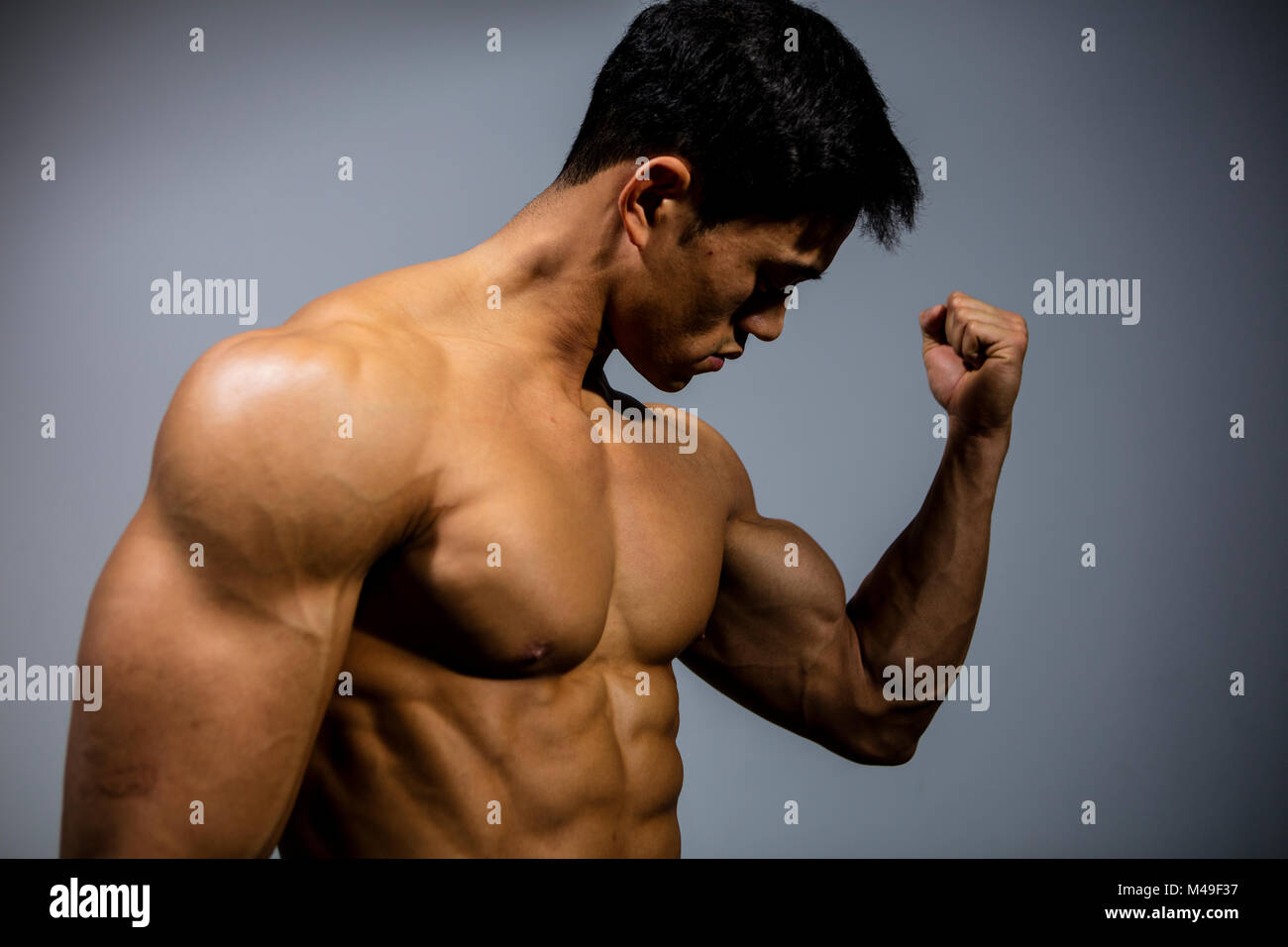 Flexes Muscle High Resolution Stock Photography and Images - Alamy