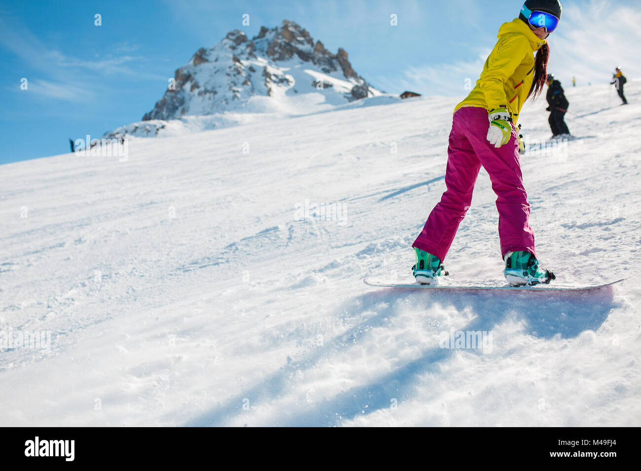 Photo of athlete snowboarding on snowy slope Stock Photo - Alamy