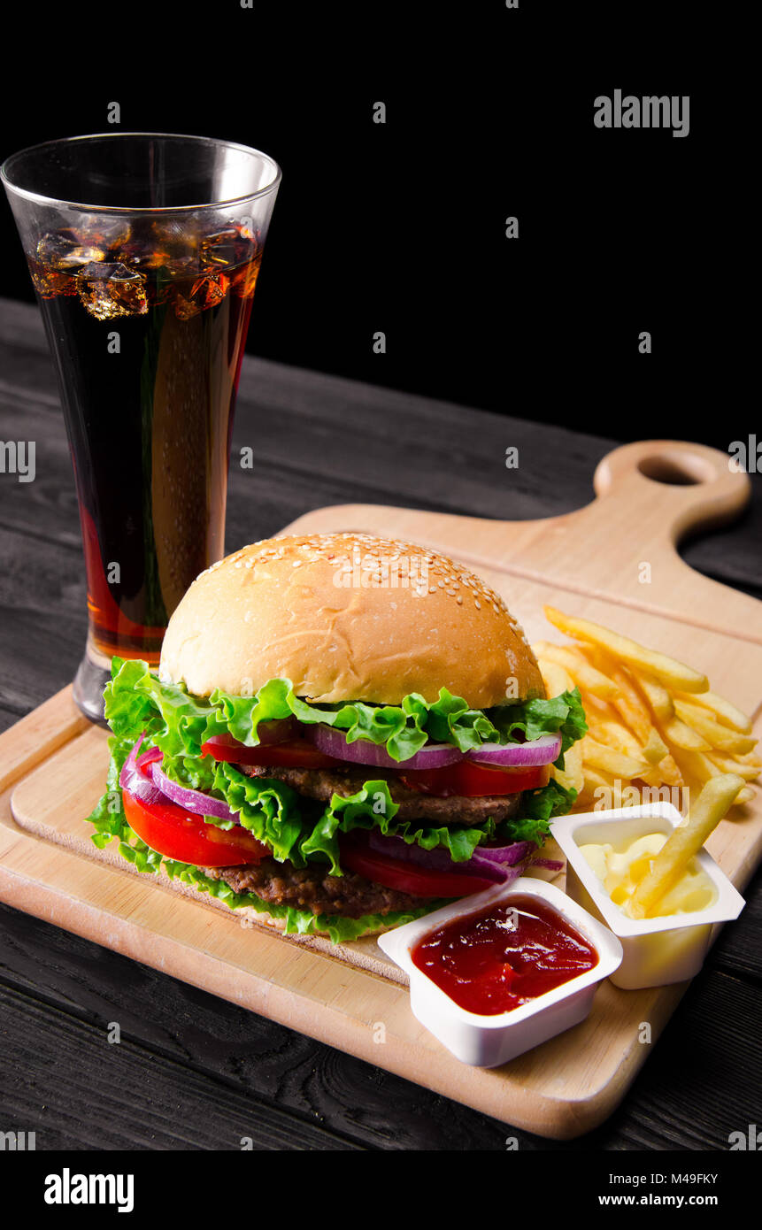 Burger served in bun in nutrition fast food concept Stock Photo - Alamy