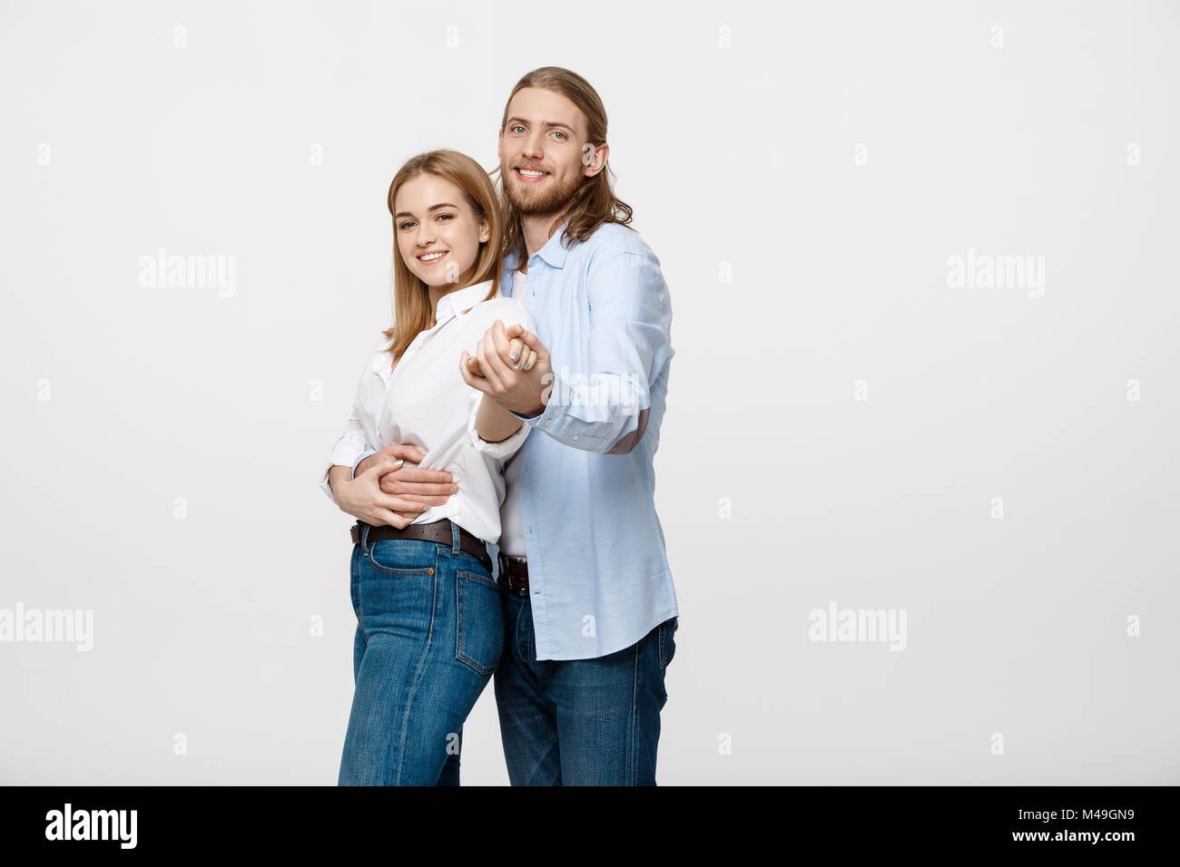 Young elegant couple in casual cloth dancing over Isolated on white ...