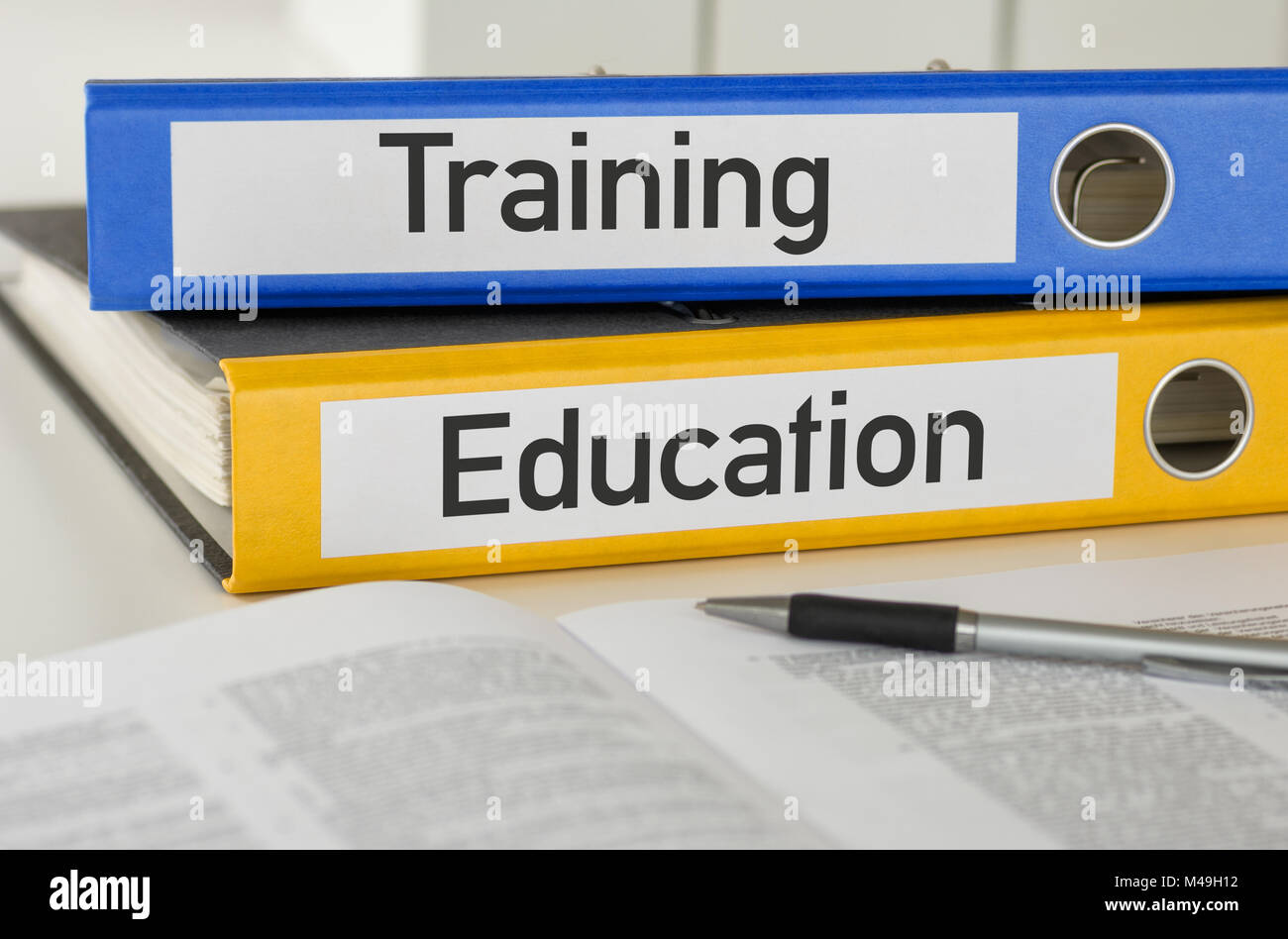 Folders with the label Training and Education Stock Photo - Alamy