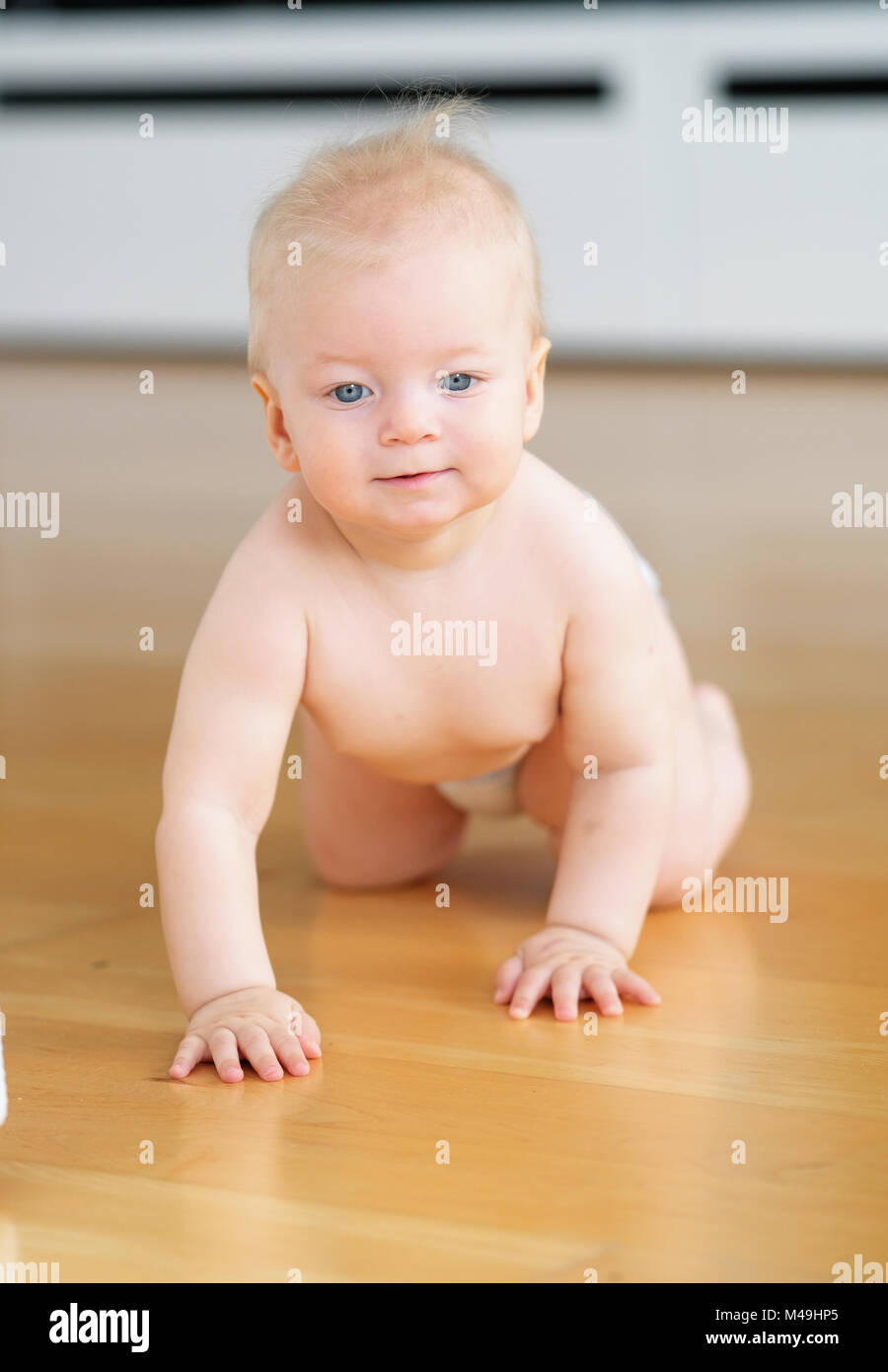 Baby boy crawling Stock Photo - Alamy