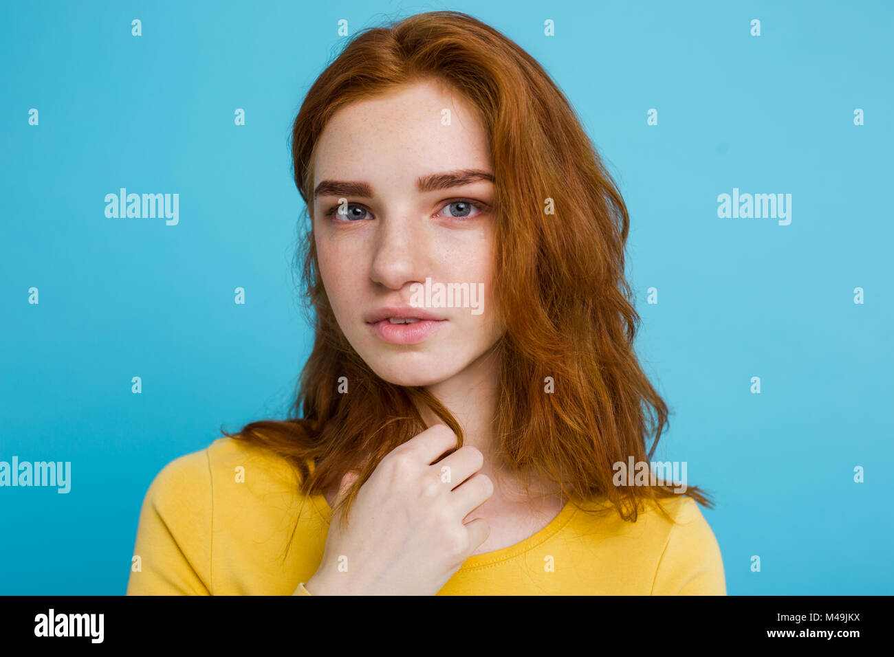 Headshot Portrait of happy ginger red hair girl with freckles smiling ...